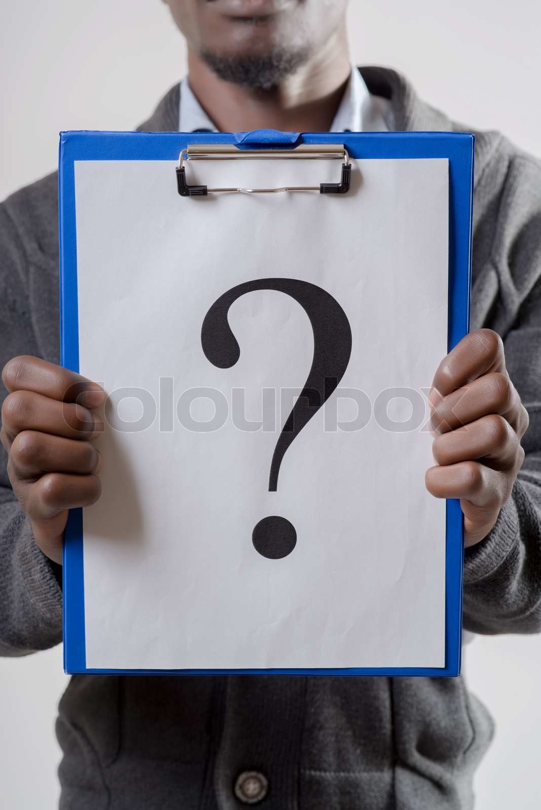 man holding a question mark | Stock image | Colourbox