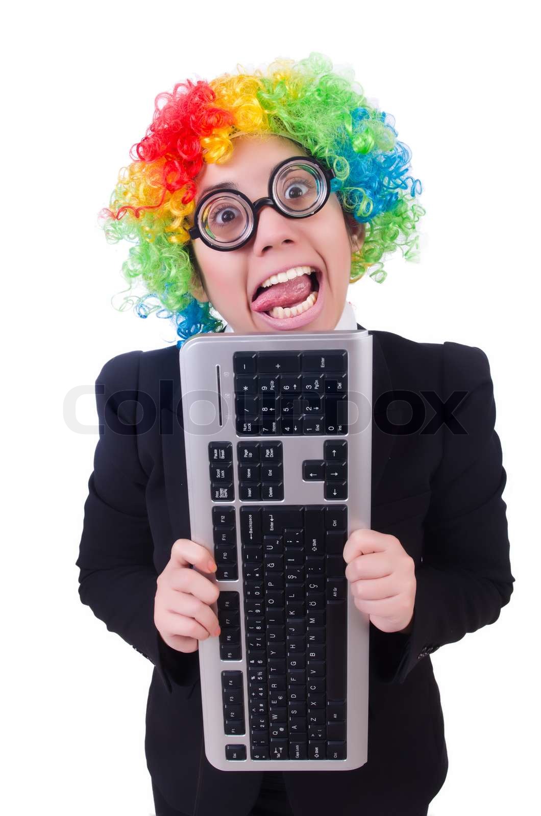Funny clown with keyboard on white | Stock image | Colourbox