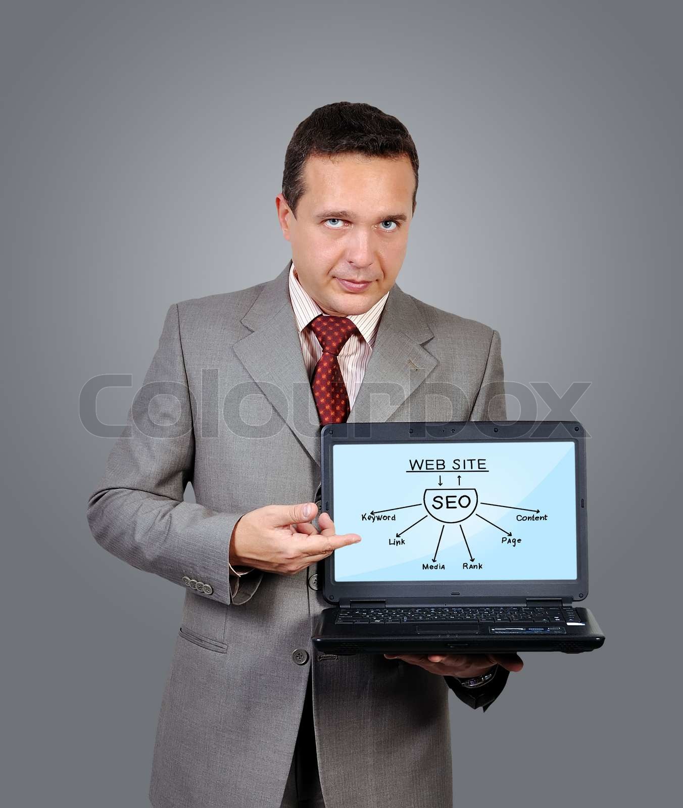 man holding laptop | Stock image | Colourbox
