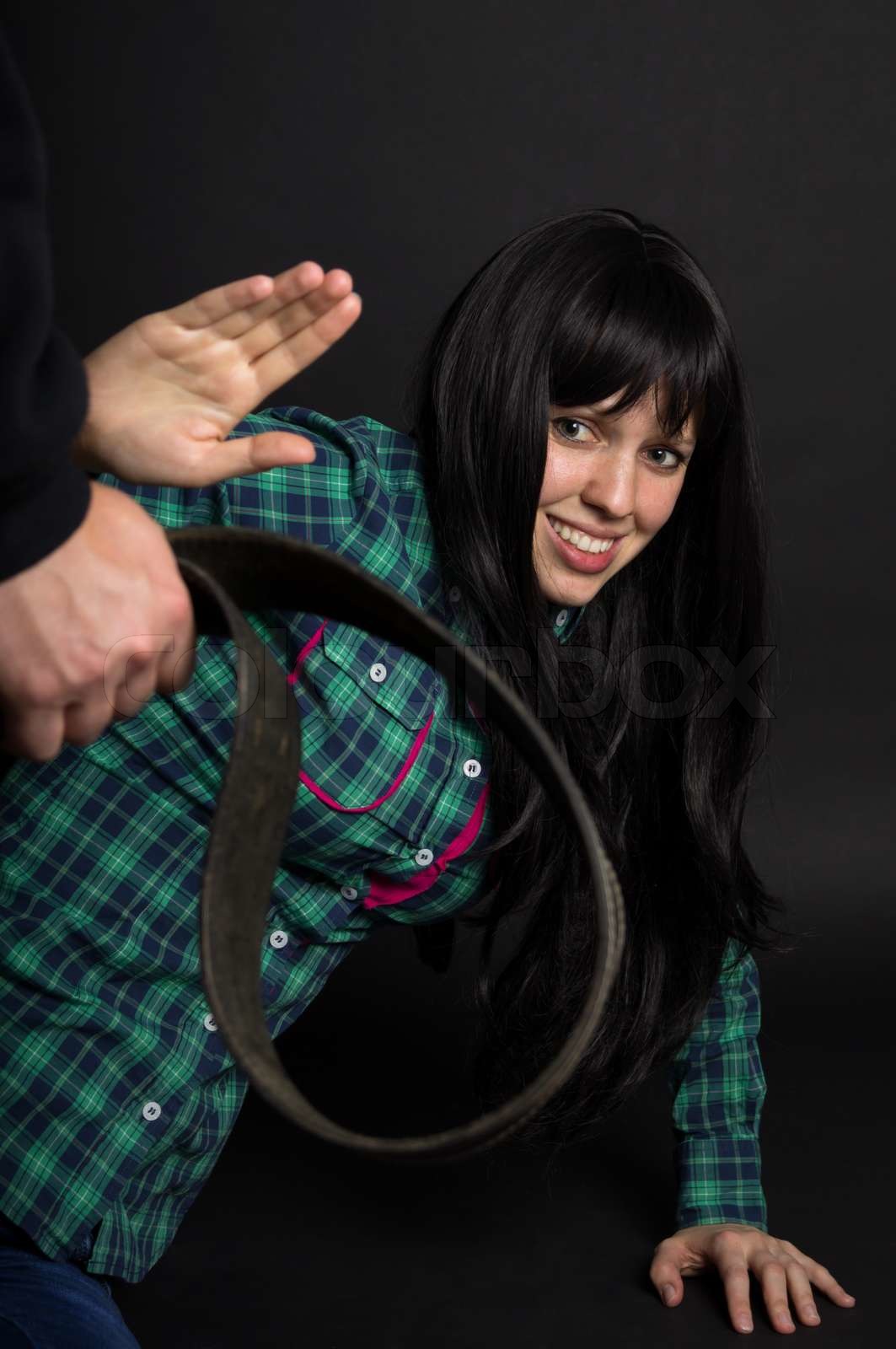 Domestic violence, battering women belt | Stock image | Colourbox