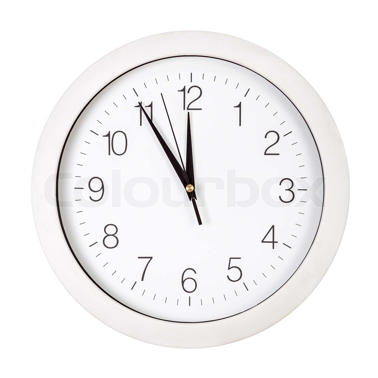 Clock face showing five minutes to twelve | Stock image | Colourbox