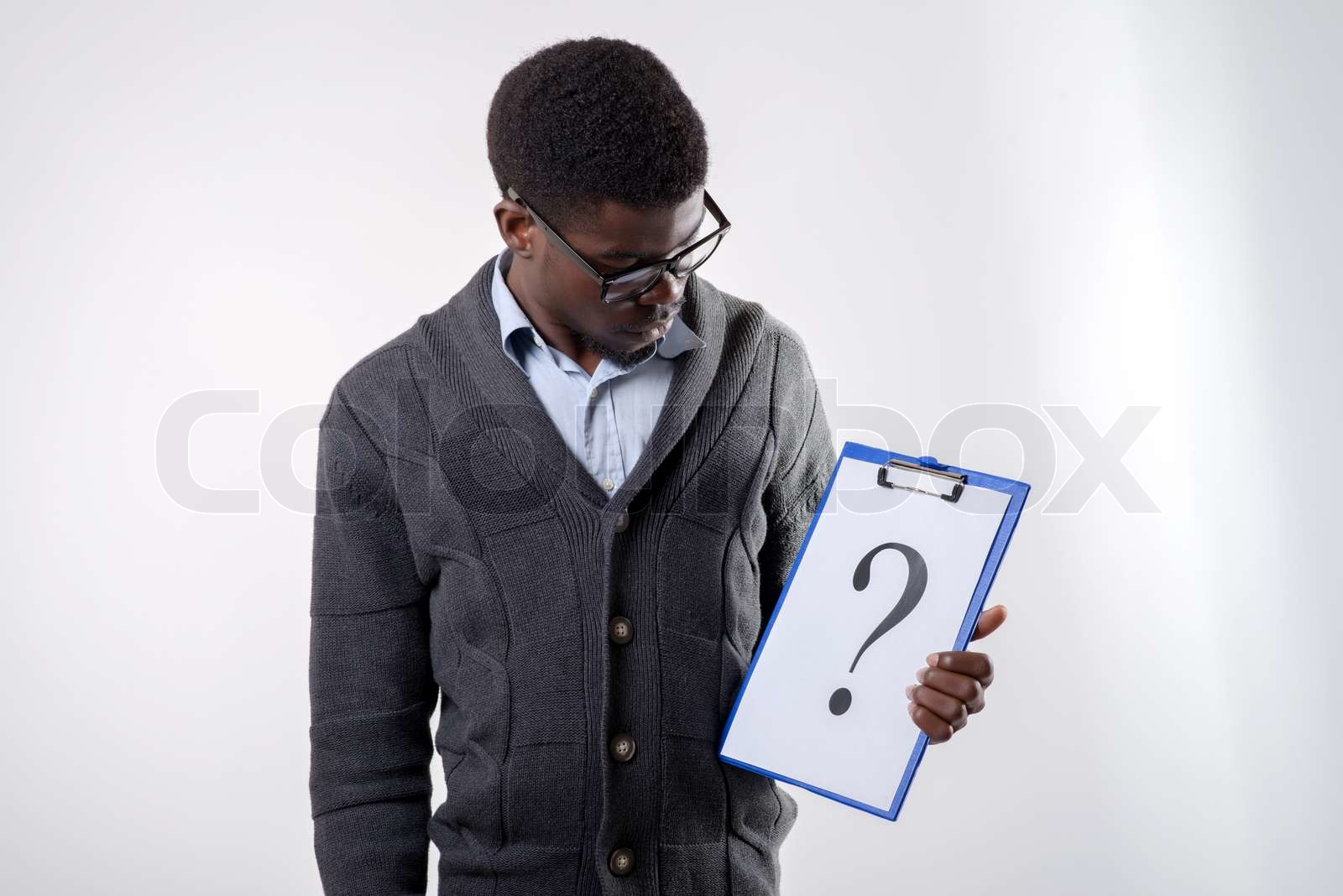 man holding a question mark | Stock image | Colourbox