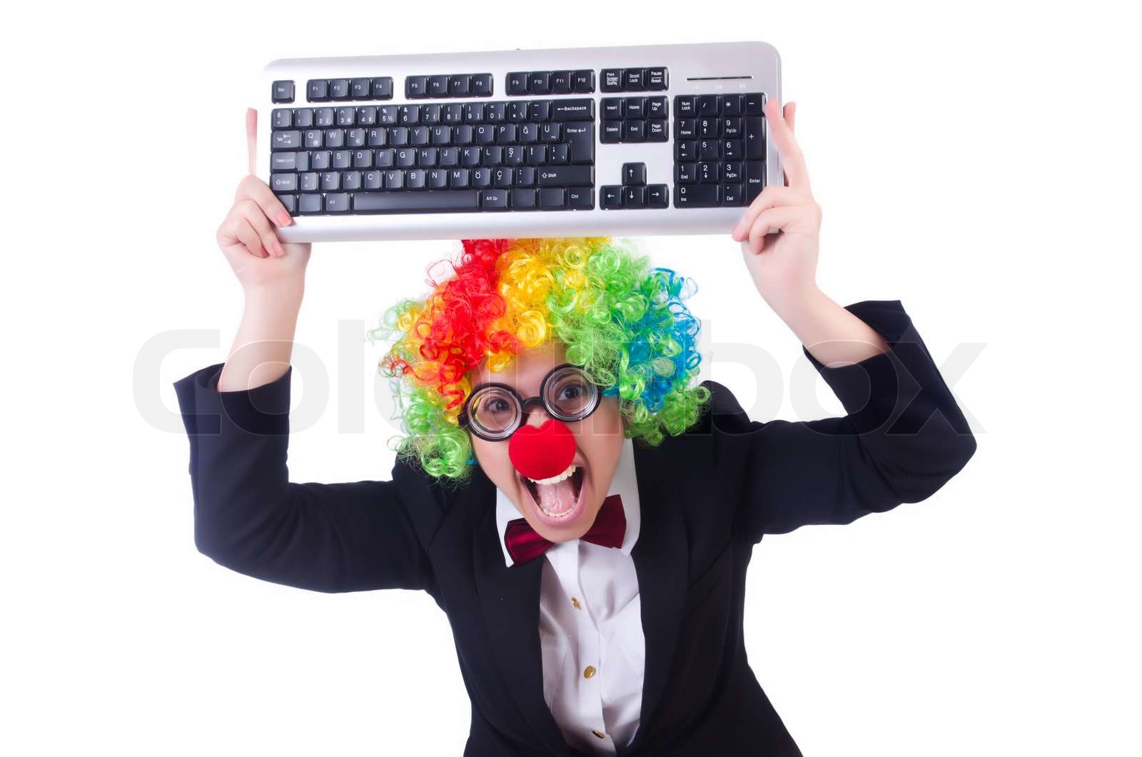 Funny clown with keyboard on white | Stock image | Colourbox