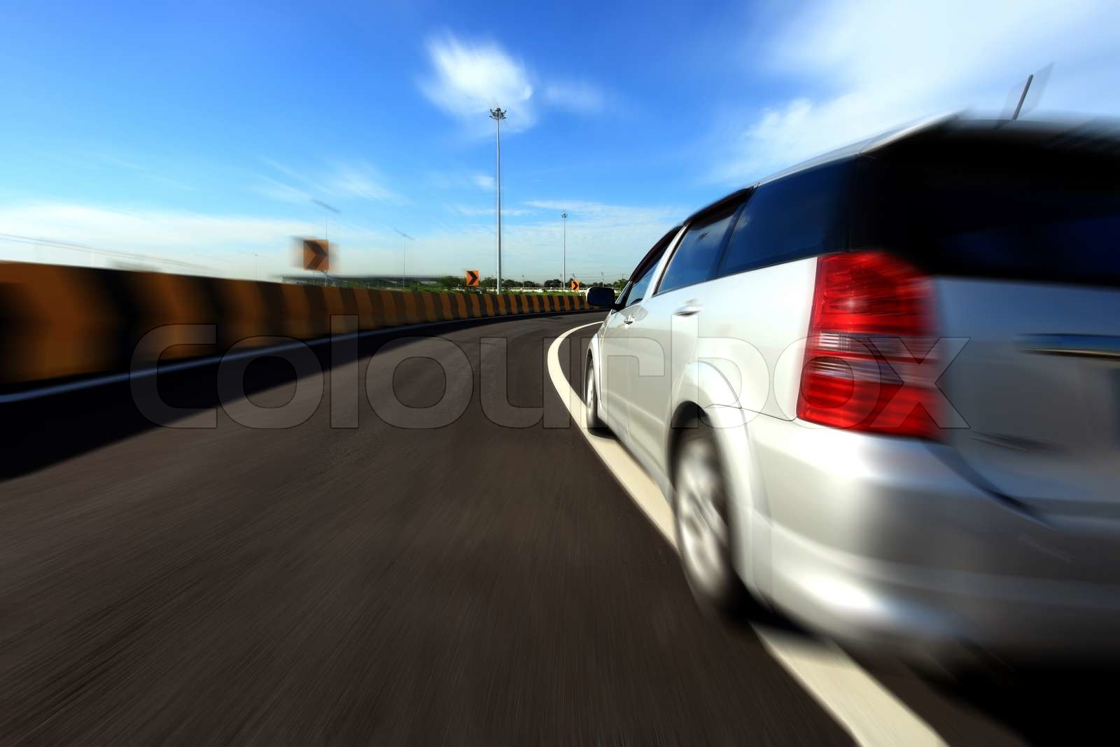 "Front side view of black car driving fast." | Stock image | Colourbox