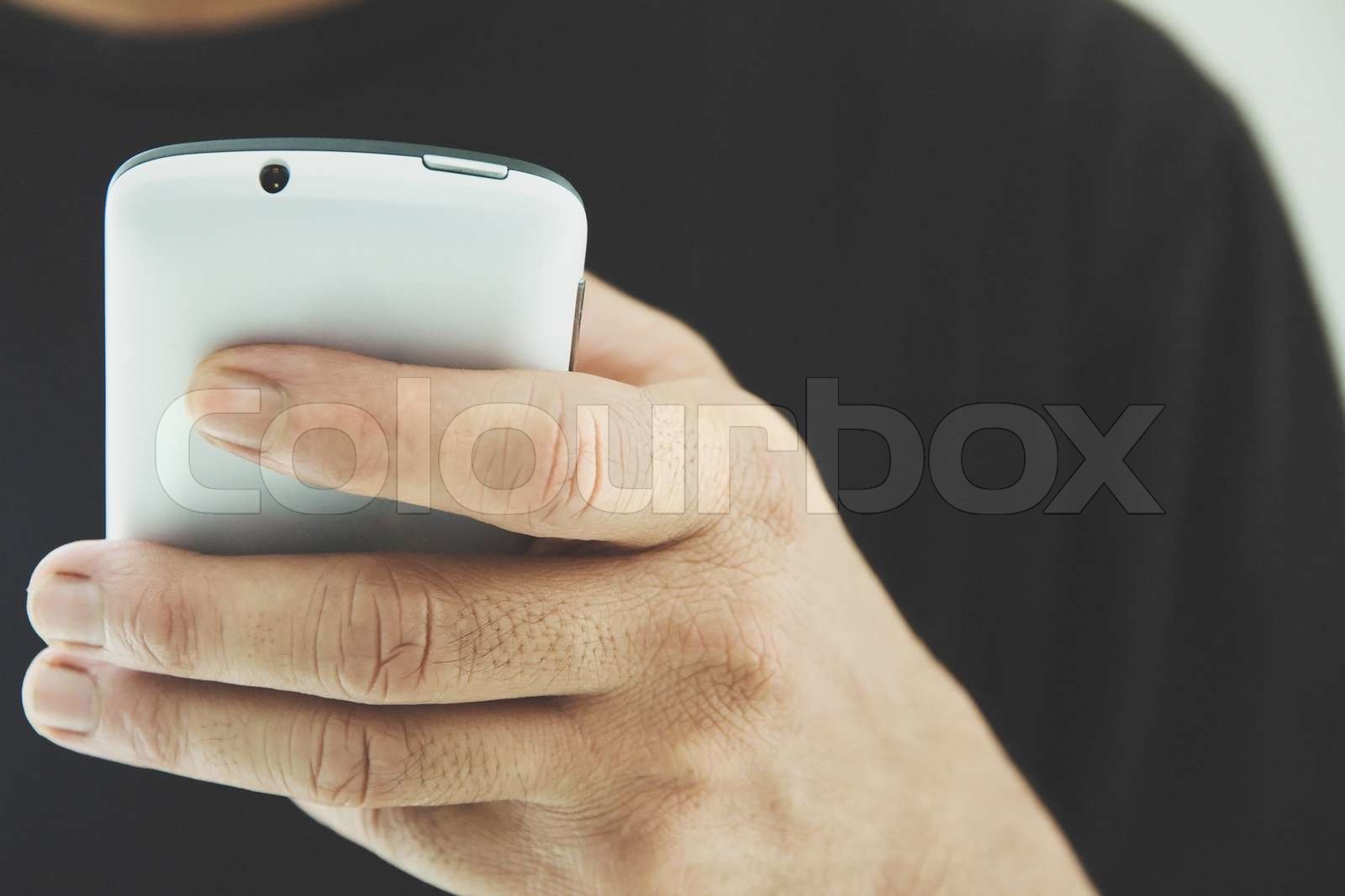 man checking his phone | Stock image | Colourbox