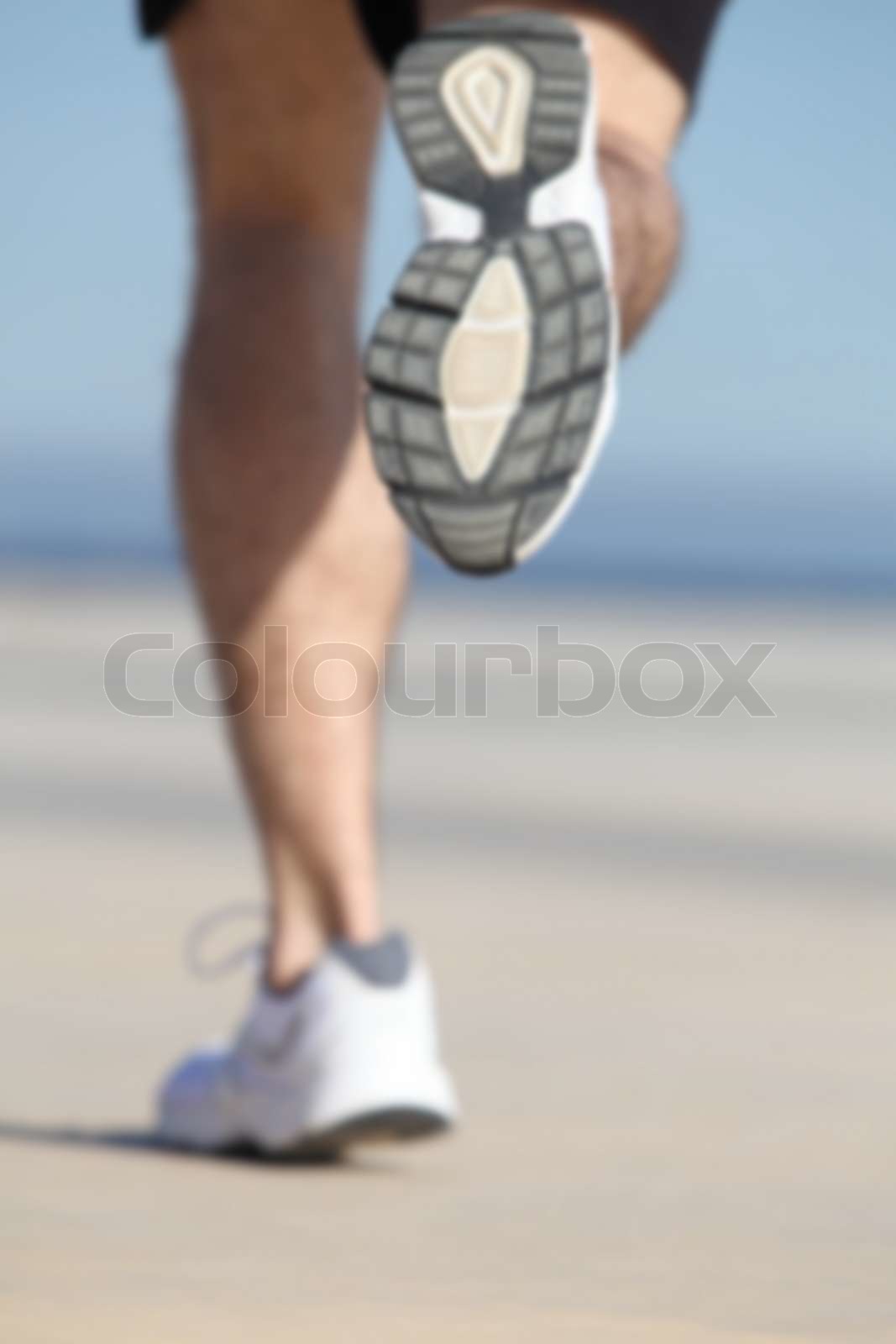 Back view of an unfocused sportsman legs running | Stock image | Colourbox