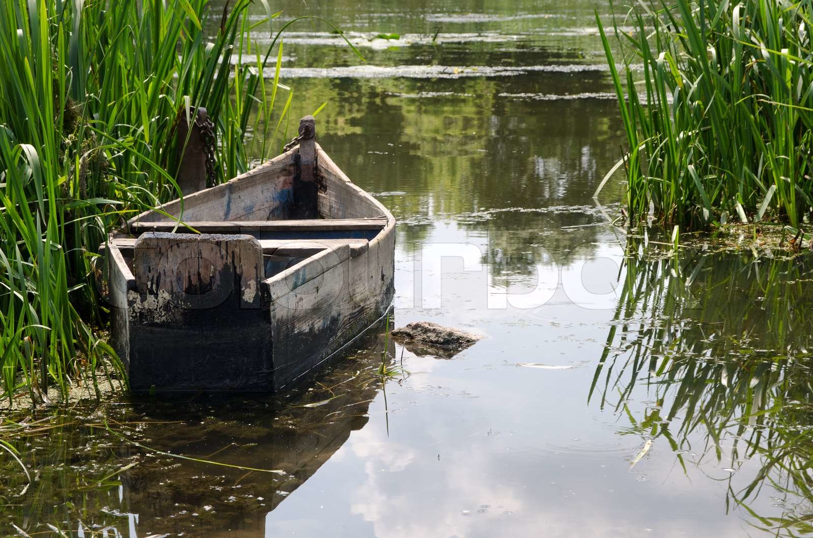 Old traditional wooden rowboat a beautiful lake | Stock image | Colourbox