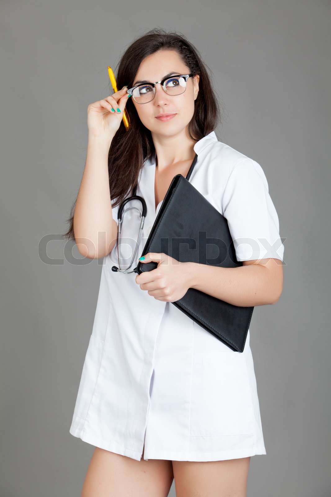 medical doctor woman with stethoscope A female doctor with a folder ...