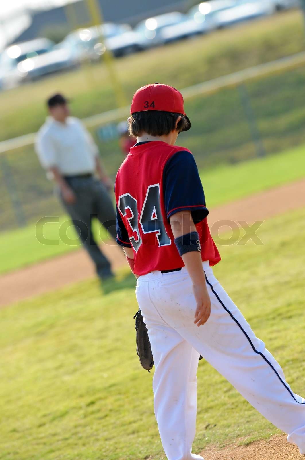Baseball boy on the field during game | Stock image | Colourbox