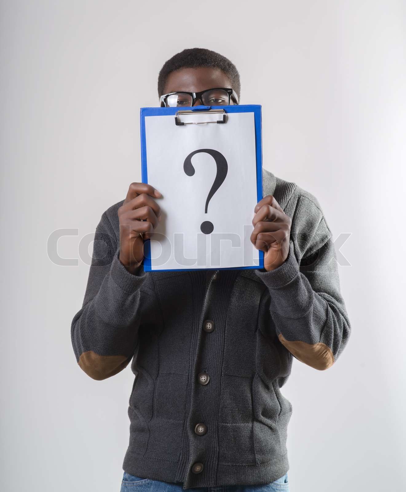 man holding a question mark | Stock image | Colourbox