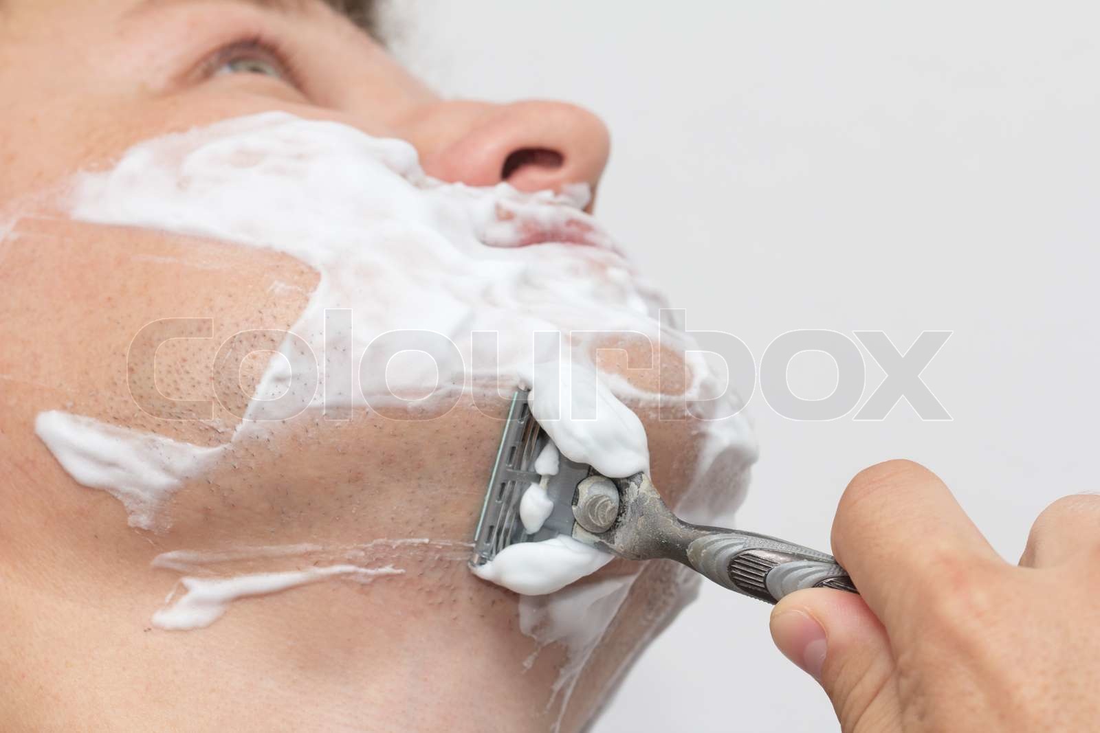 man shaves | Stock image | Colourbox