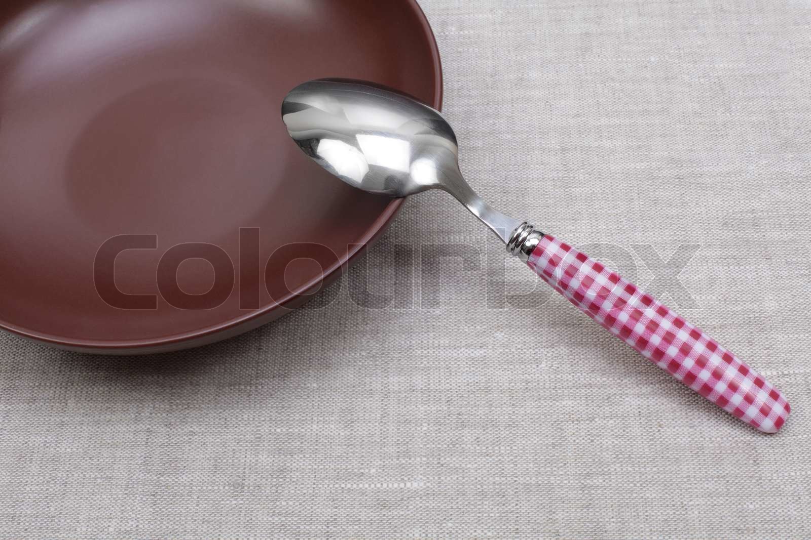 empty plate with spoon | Stock image | Colourbox