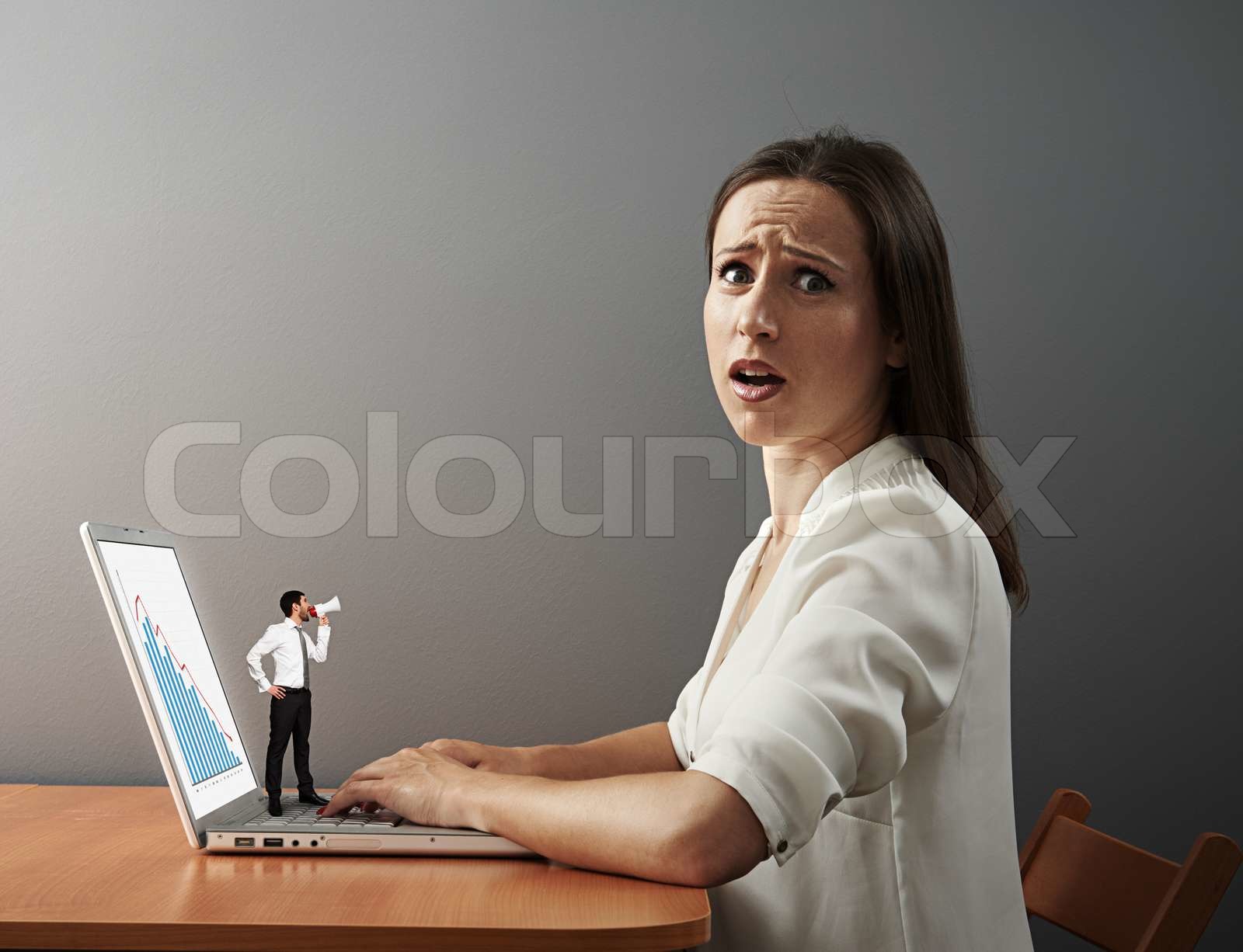 boss forcing bad worker to work | Stock image | Colourbox