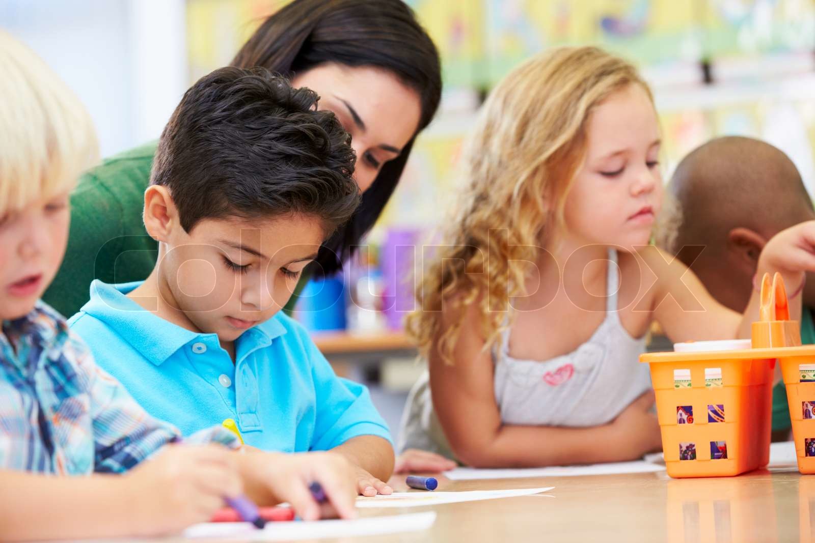 Group Of Elementary Age Children In Art Class With Teacher | Stock ...