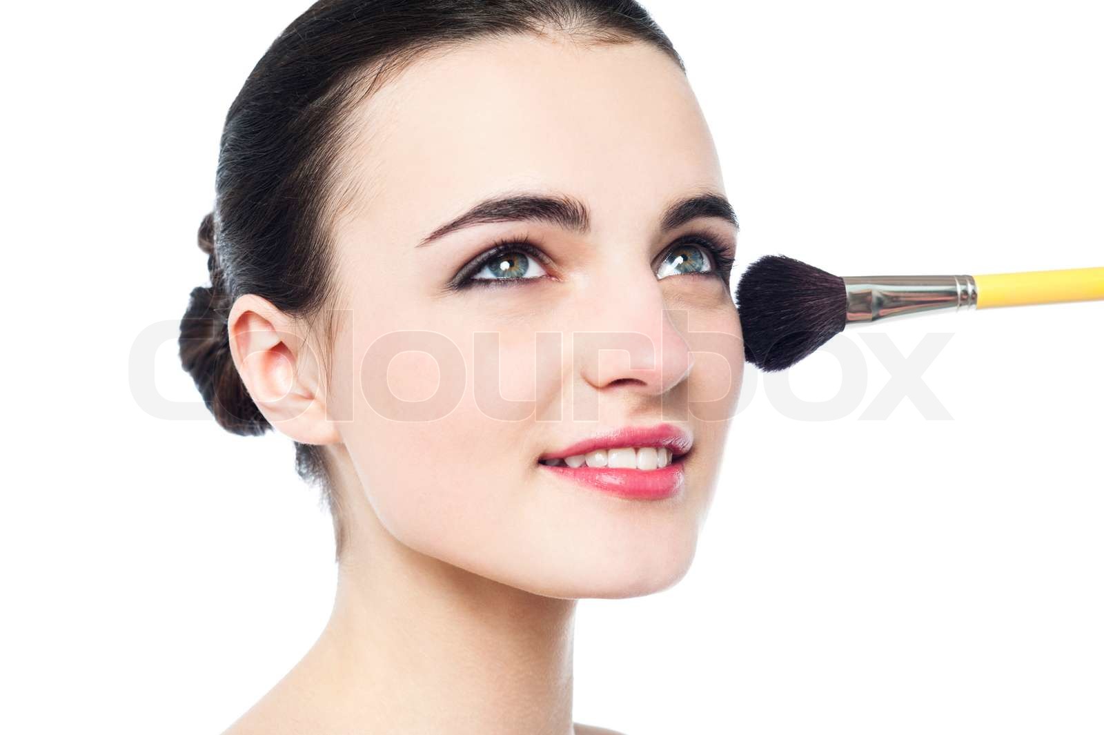 Pretty girl getting face makeup done | Stock image | Colourbox