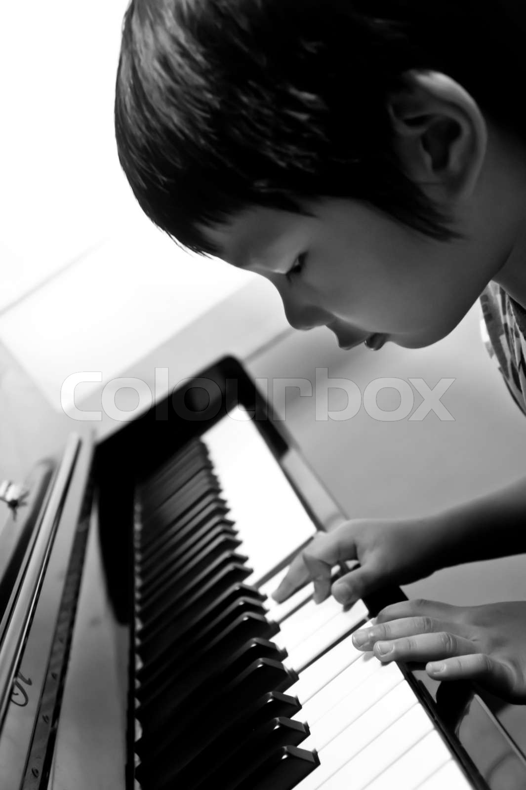 Boy Playing Piano Stock Image Colourbox boy-playing-piano-stock-image-colourbox
