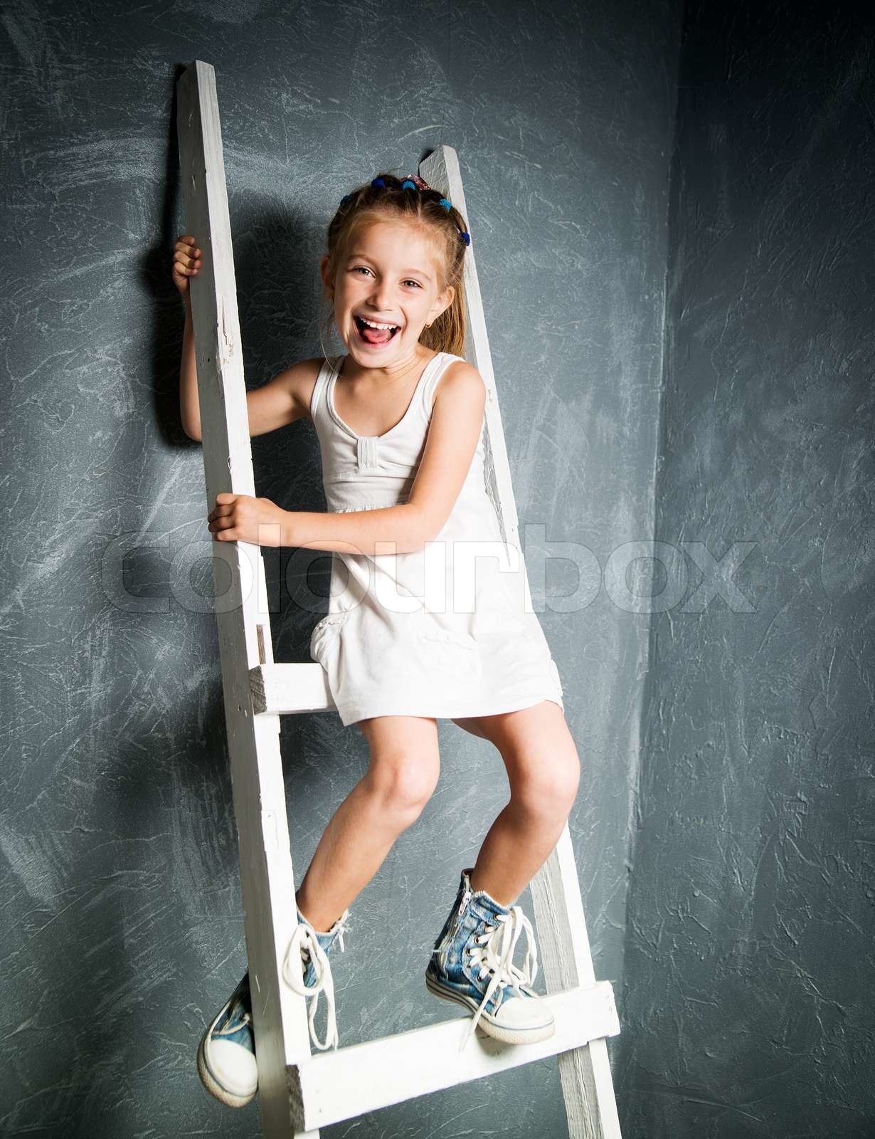 little girl on stairs | Stock image | Colourbox
