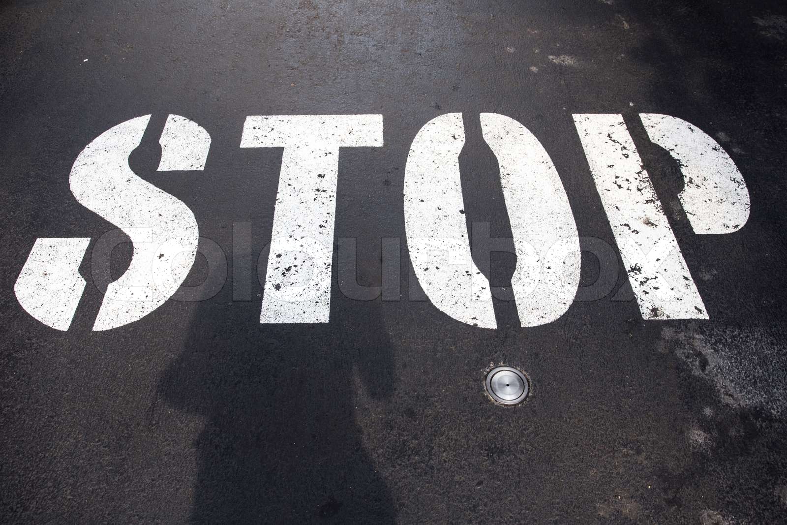 Stop text label on road | Stock image | Colourbox