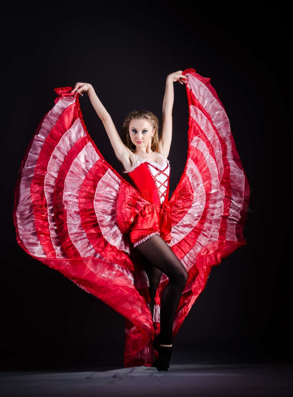 Girl in red dress dancing dance | Stock image | Colourbox