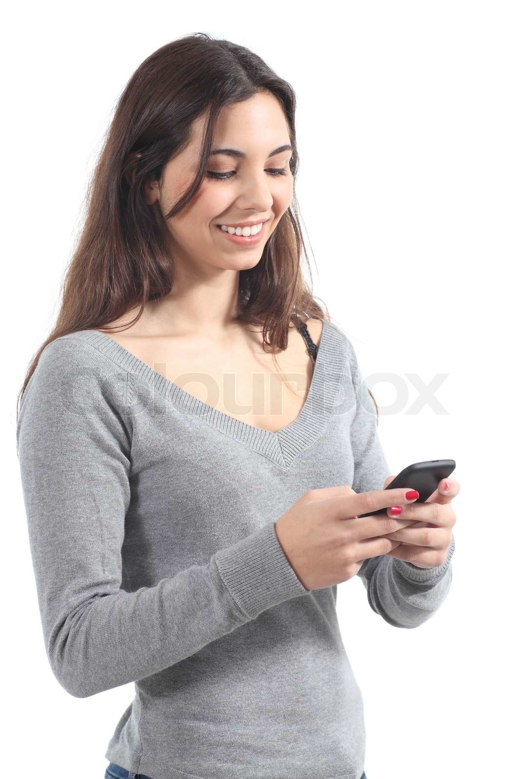 Beautiful girl sending a message with a mobile phone | Stock image ...
