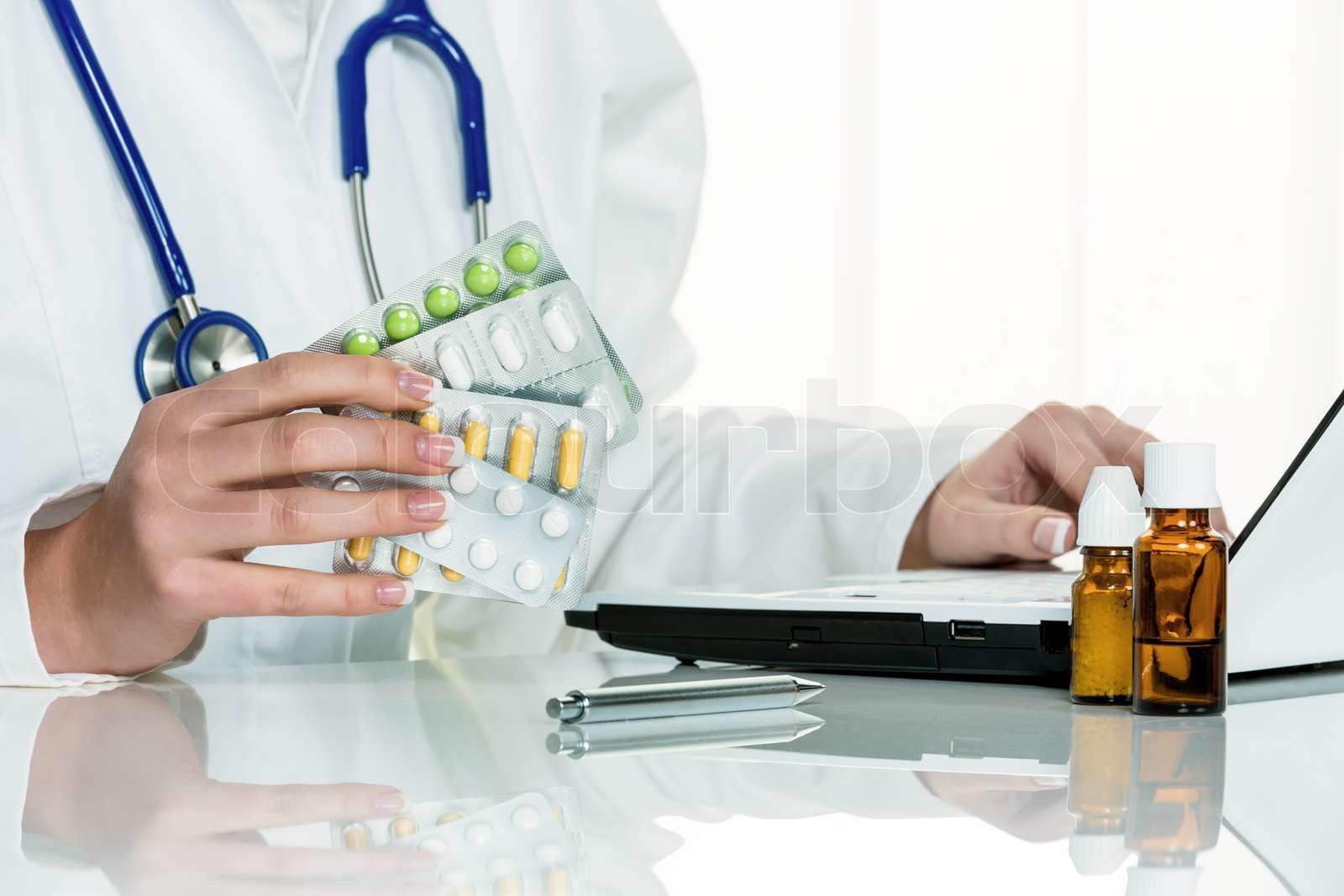 doctor writes a prescription for tablets | Stock image | Colourbox