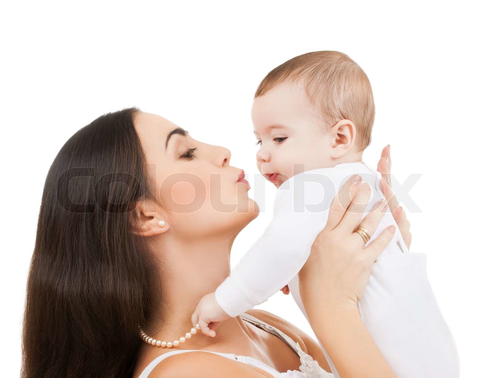 lykkelig mor kysse hendes barn | Stock foto | Colourbox