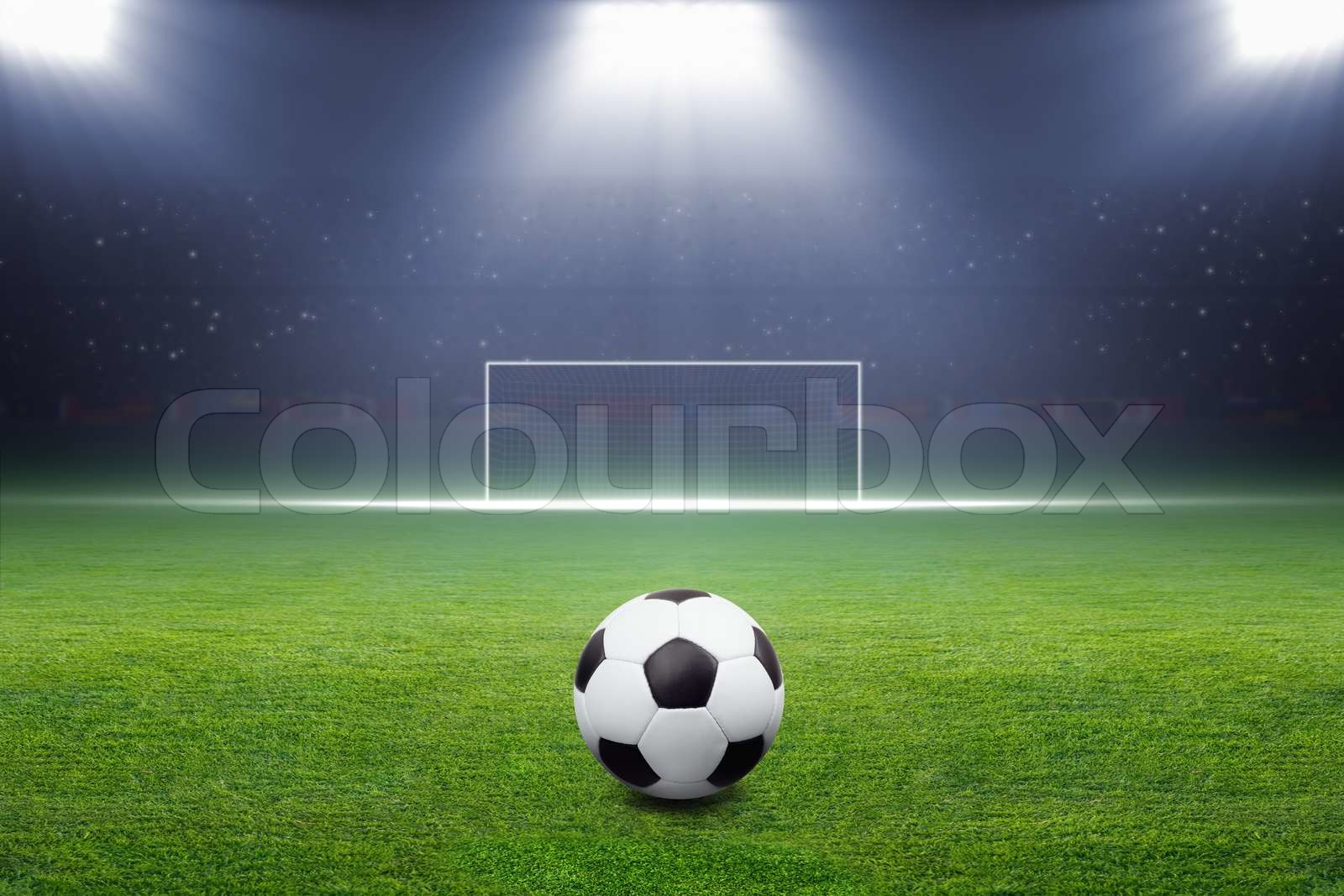 Soccer ball, goal, spotlight | Stock image | Colourbox