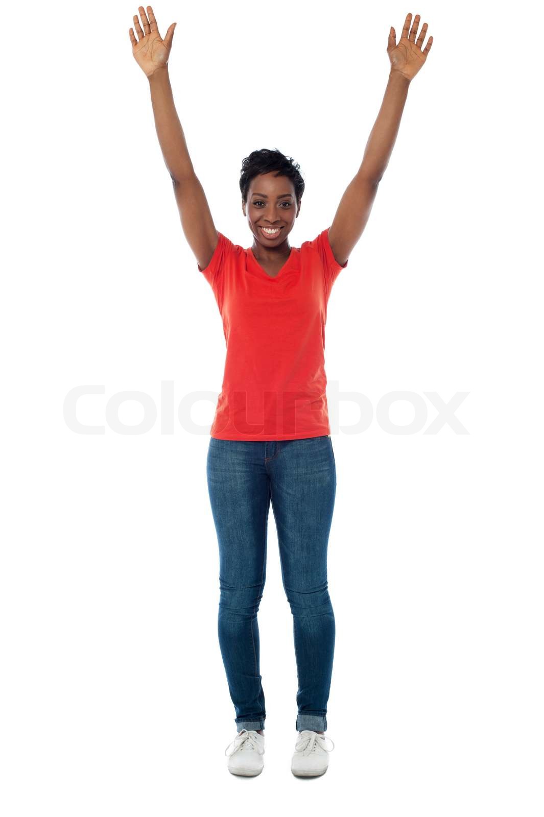 Excited woman raising her arms up | Stock image | Colourbox