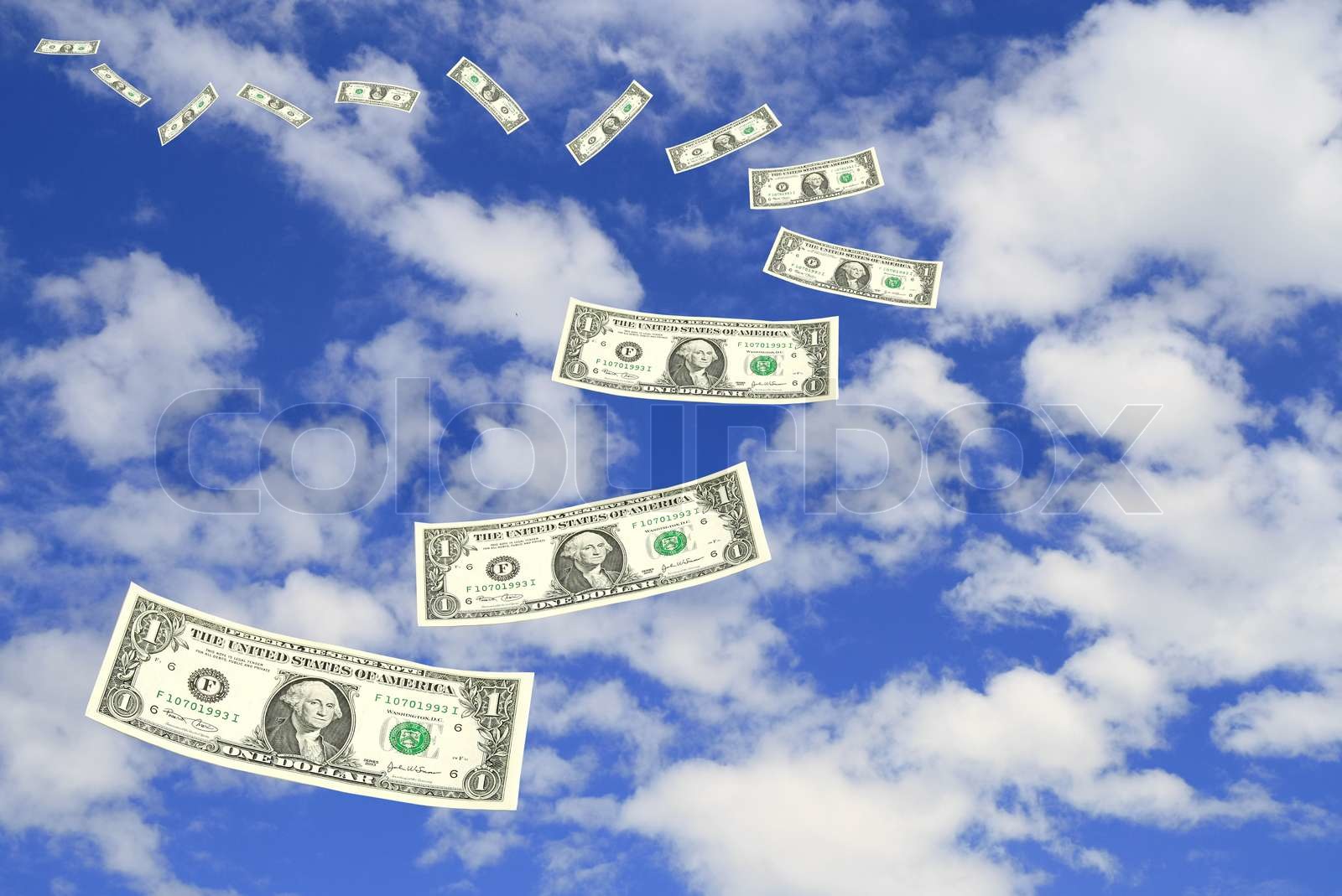 Dollar bill fly in sky | Stock image | Colourbox