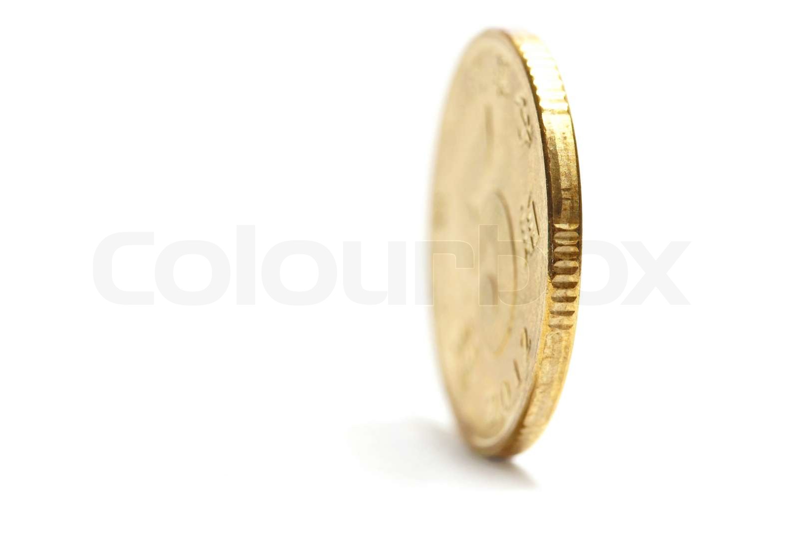one gold coin standing | Stock image | Colourbox