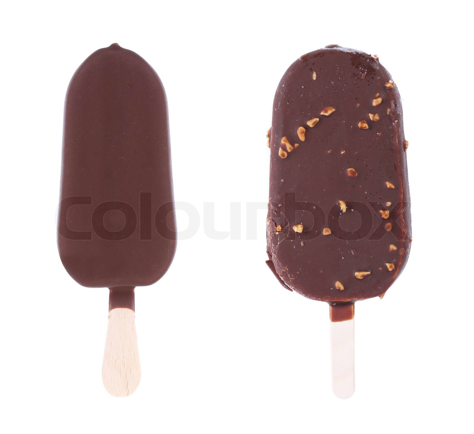 Two chocolate-coated blocks of ice cream on stick | Stock image | Colourbox