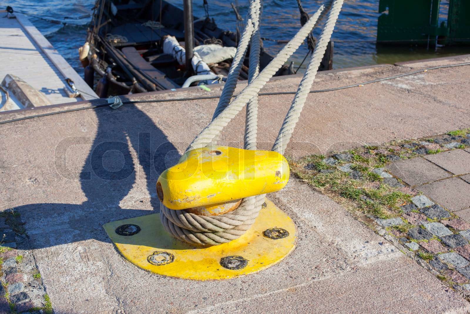 Ships mooring bollard with heavy duty mooring ropes | Stock image ...