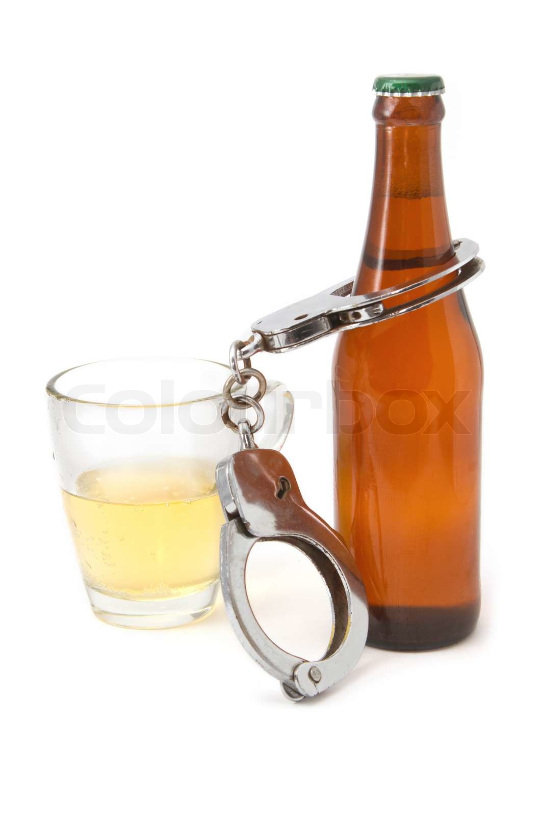 bottle beer and handcuffs,Drunk driving concept | Stock image | Colourbox