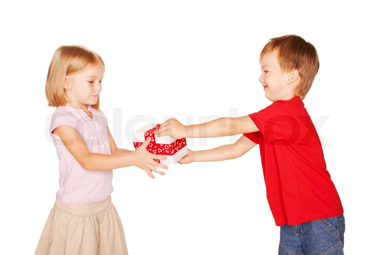 Little boy giving a little girl a gift | Stock image | Colourbox