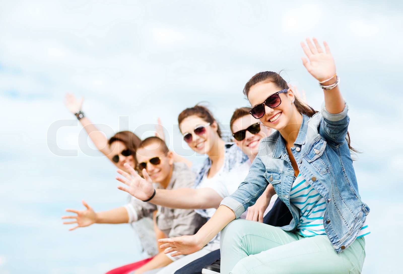 group of teenagers waving hands | Stock image | Colourbox