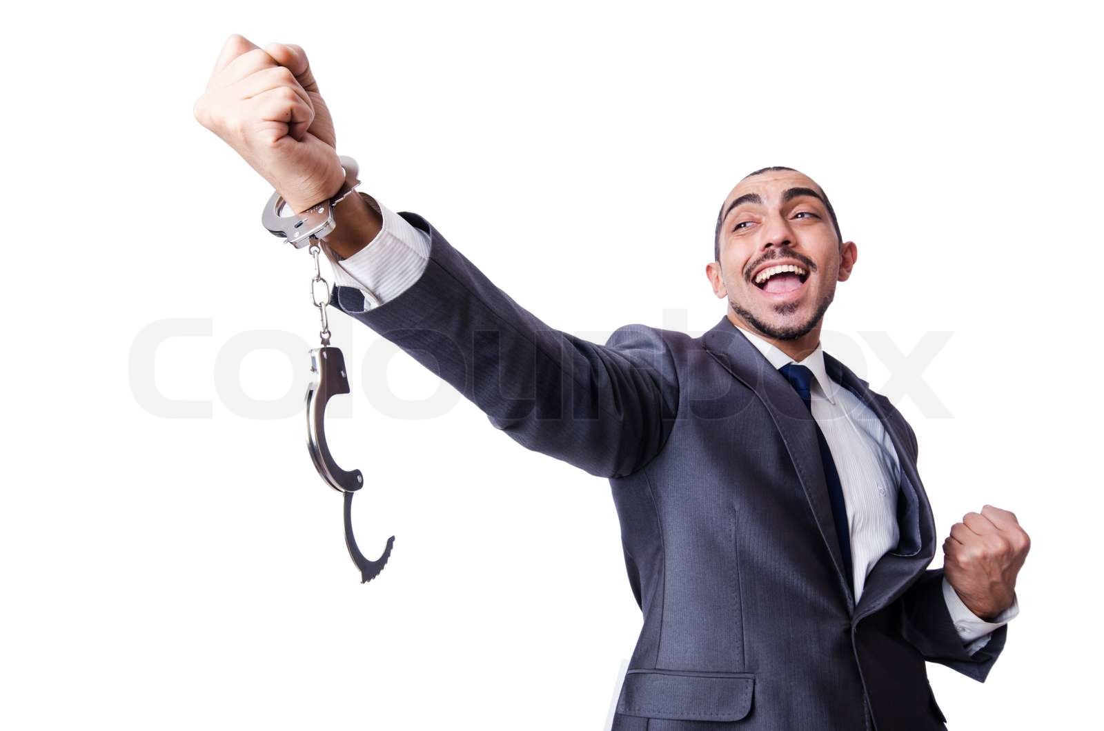 Funny businessman with handcuffs on white | Stock image | Colourbox