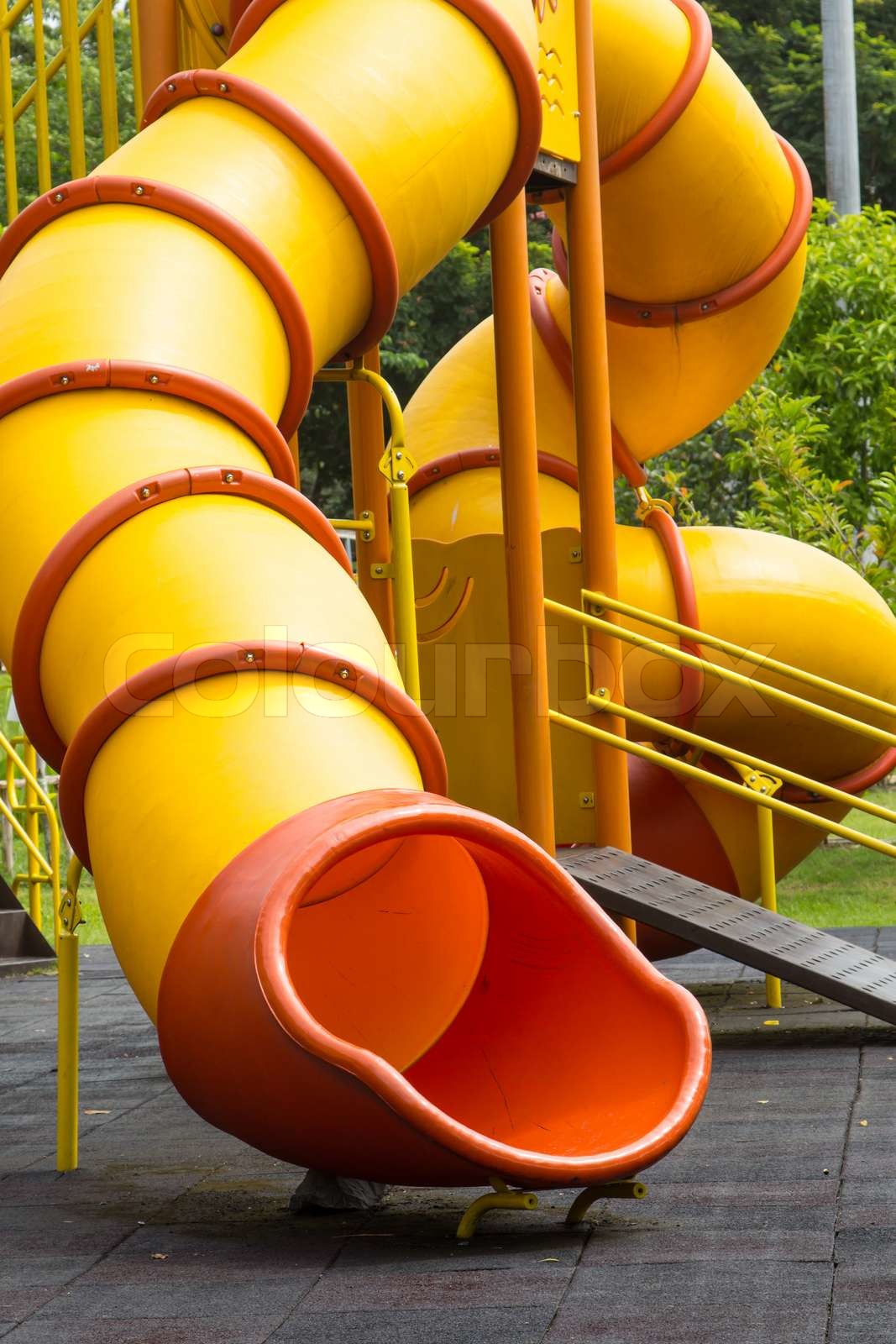 Yellow slider located on the playground | Stock image | Colourbox