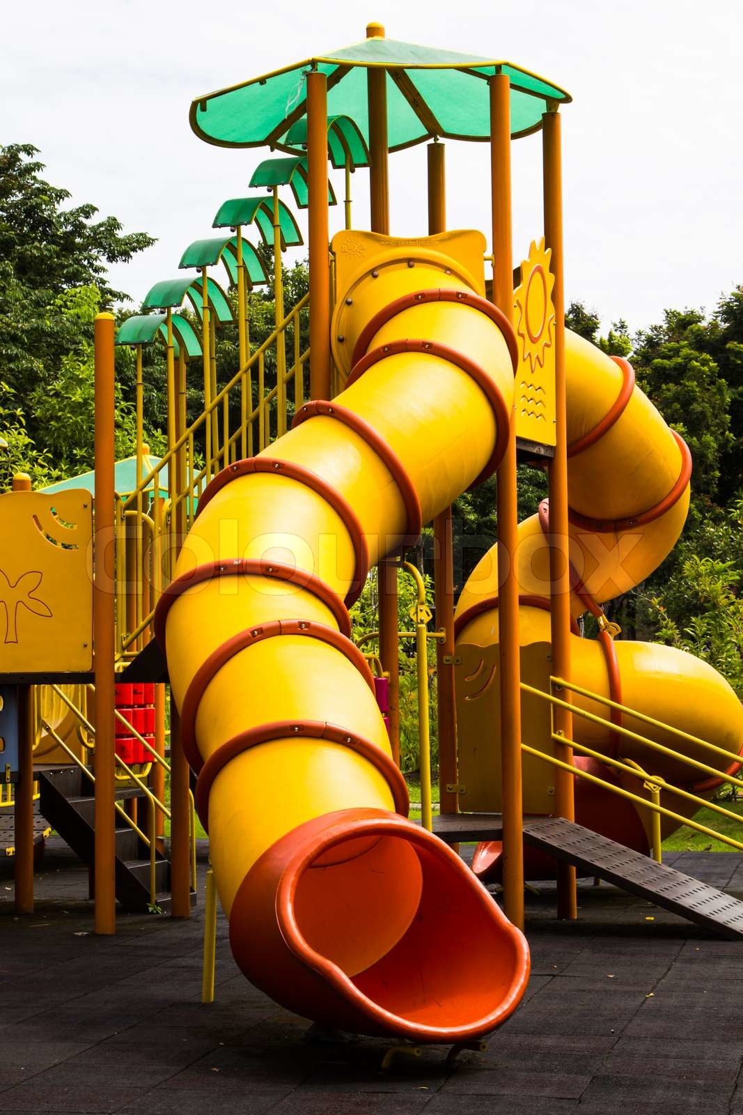 Yellow slider located on the playground | Stock image | Colourbox