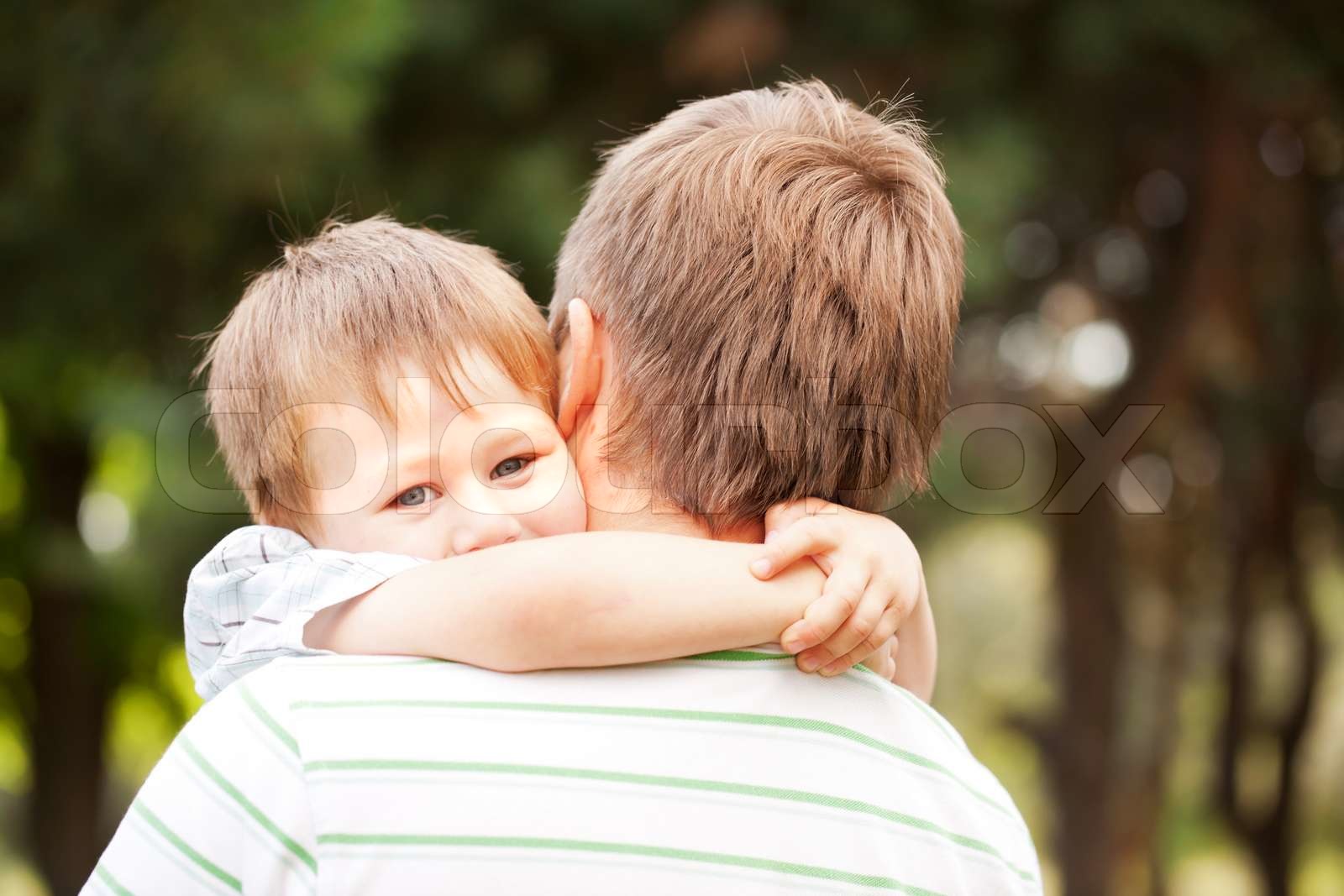Child hugging daddy | Stock image | Colourbox