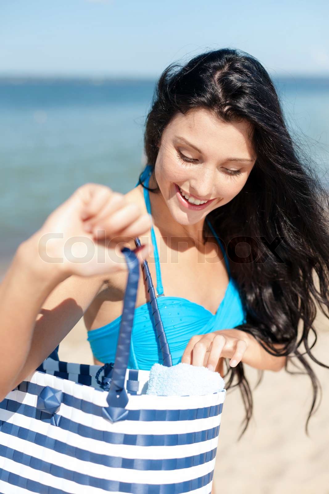 girl sunbathing on the beach | Stock image | Colourbox