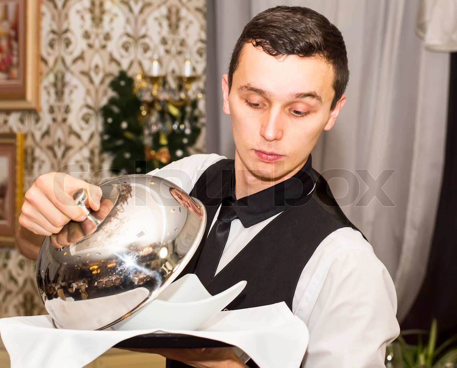 Vintage portrait of a waiter in a restaurant | Stock image | Colourbox