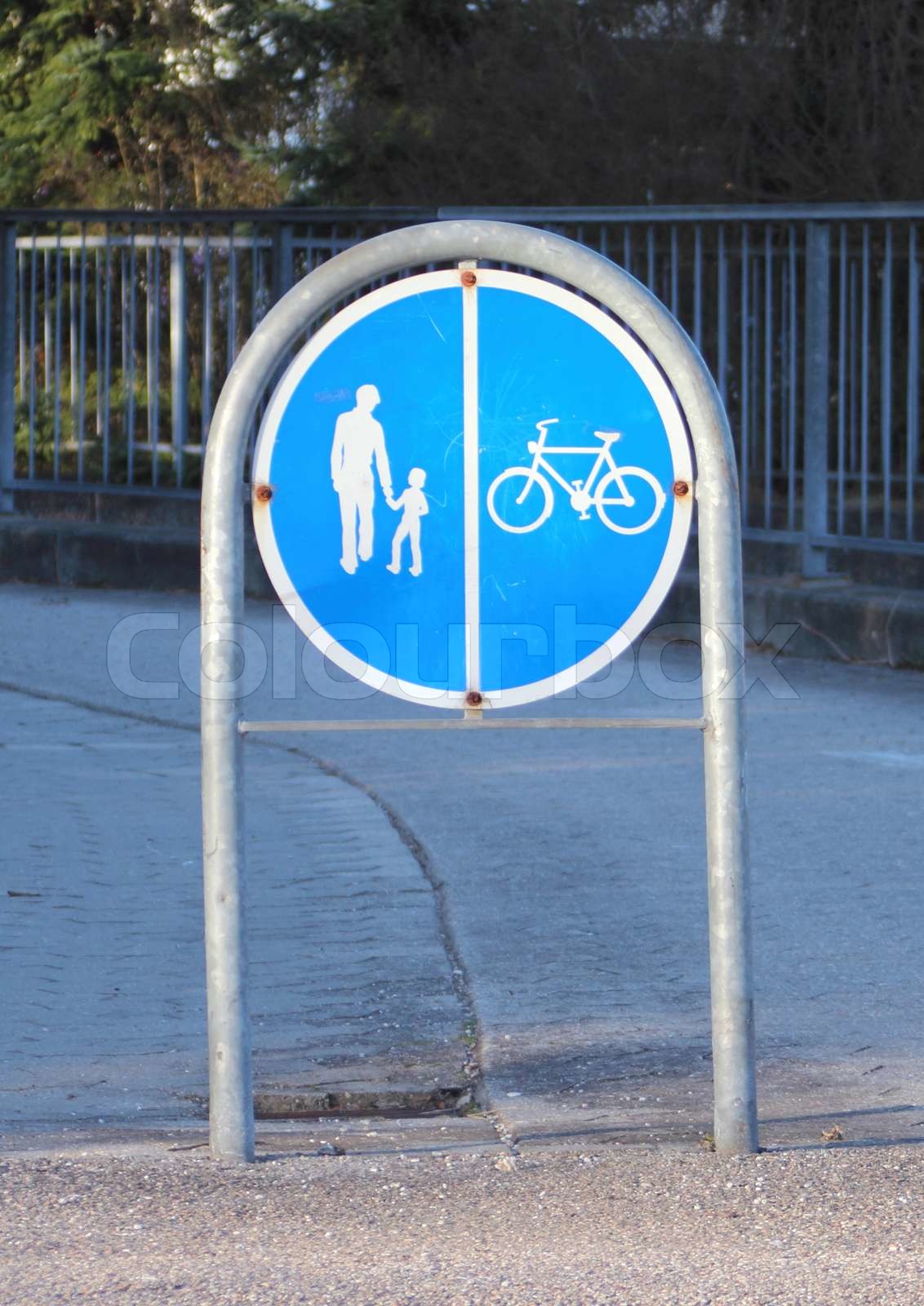 Sign to separate promenade and biking area | Stock image | Colourbox