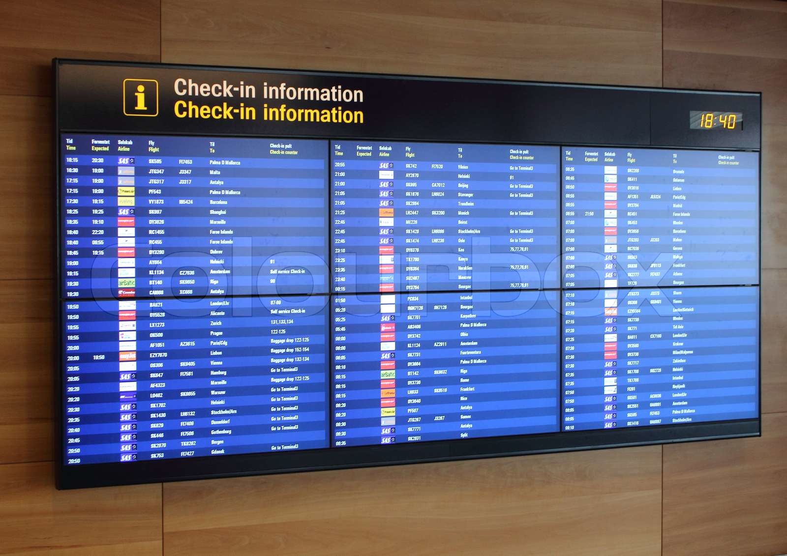 Bording screen with timetable at airport | Stock image | Colourbox