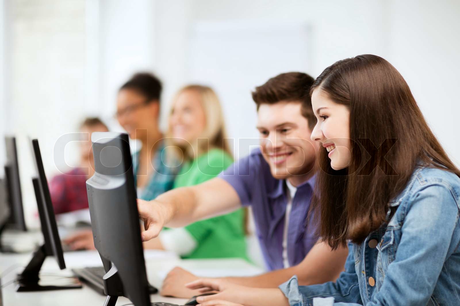 students with computers studying at school | Stock image | Colourbox