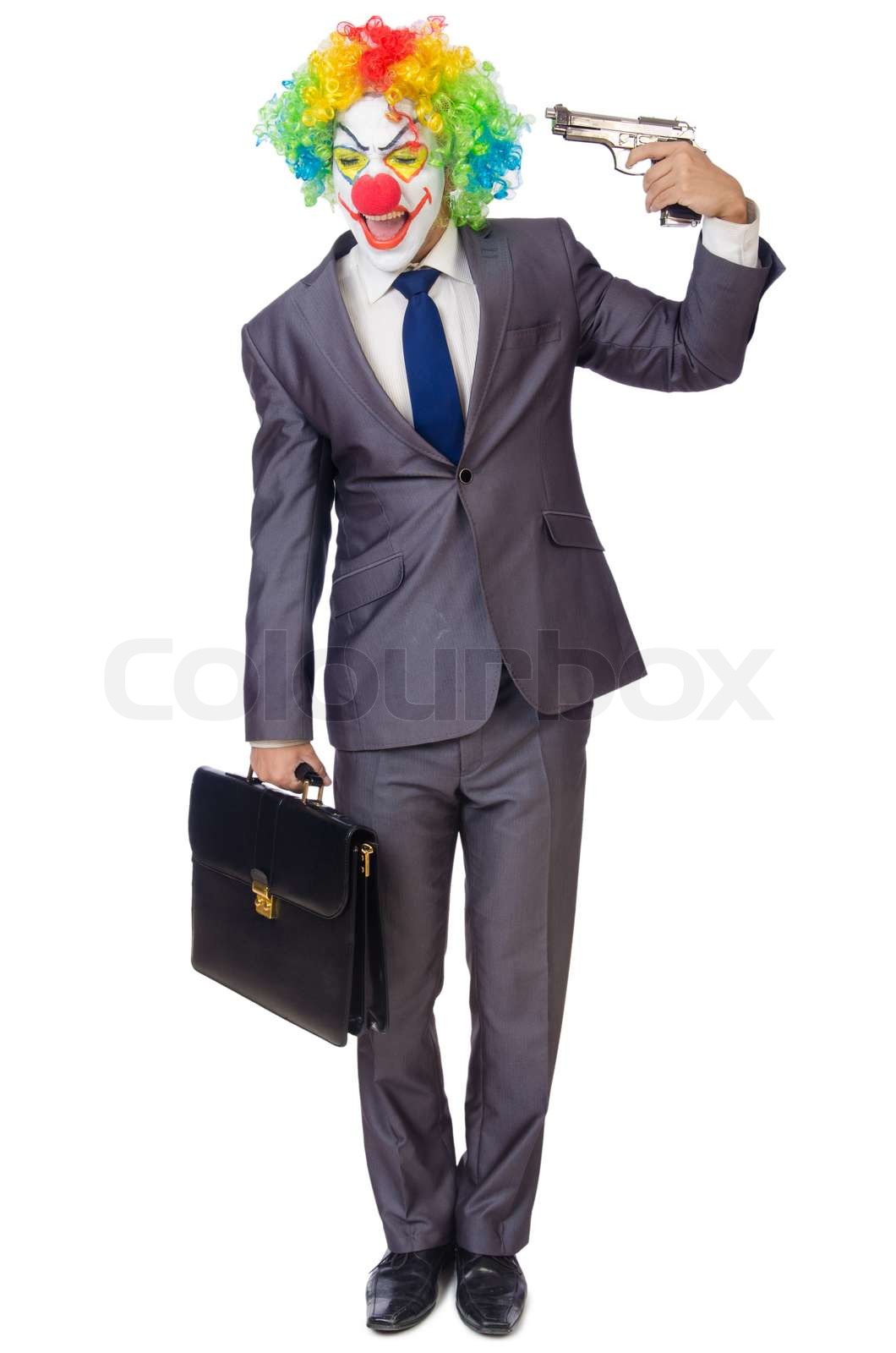 Businessman clown with gun isolated on white | Stock image | Colourbox