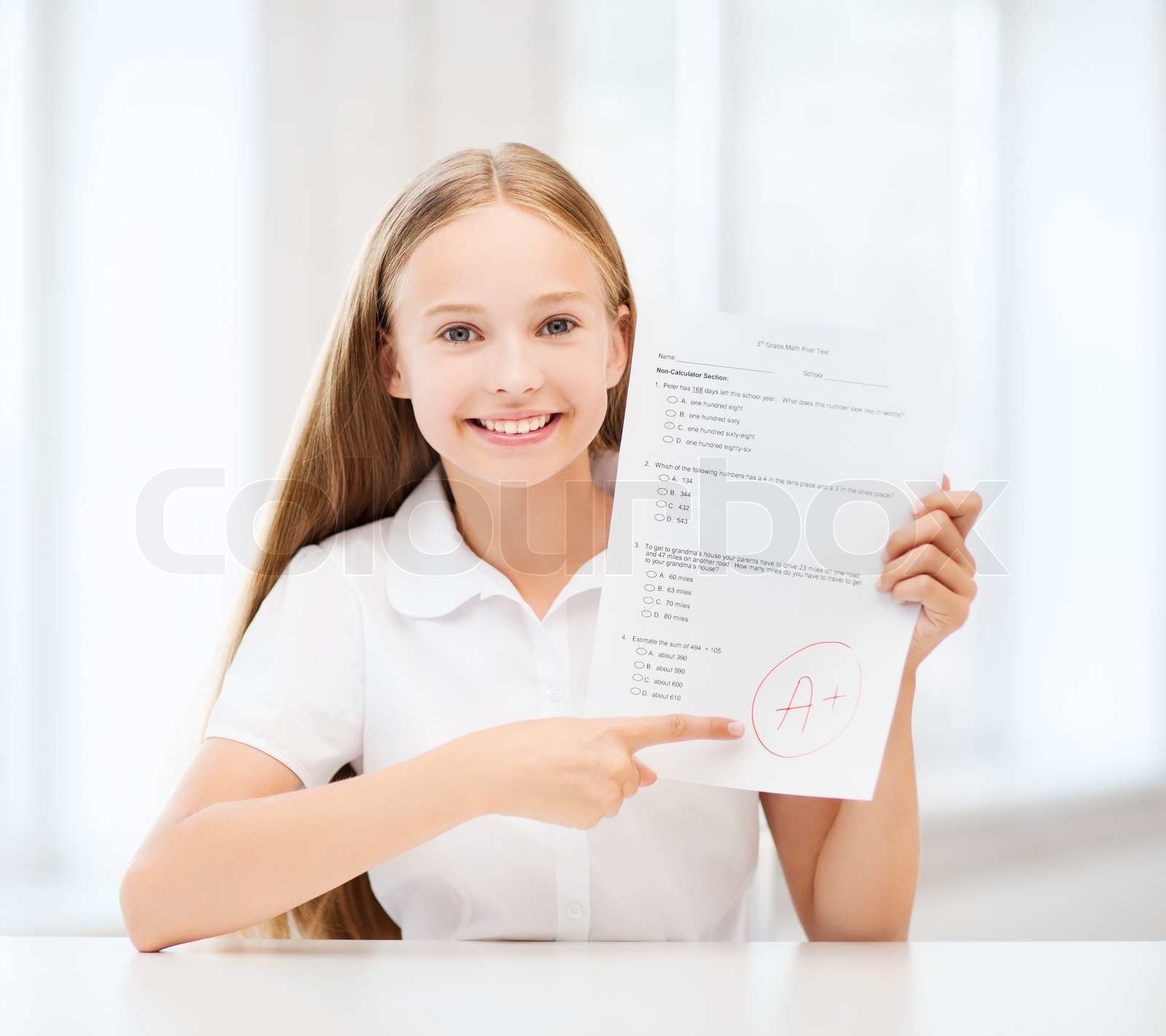 girl with test and grade at school | Stock image | Colourbox