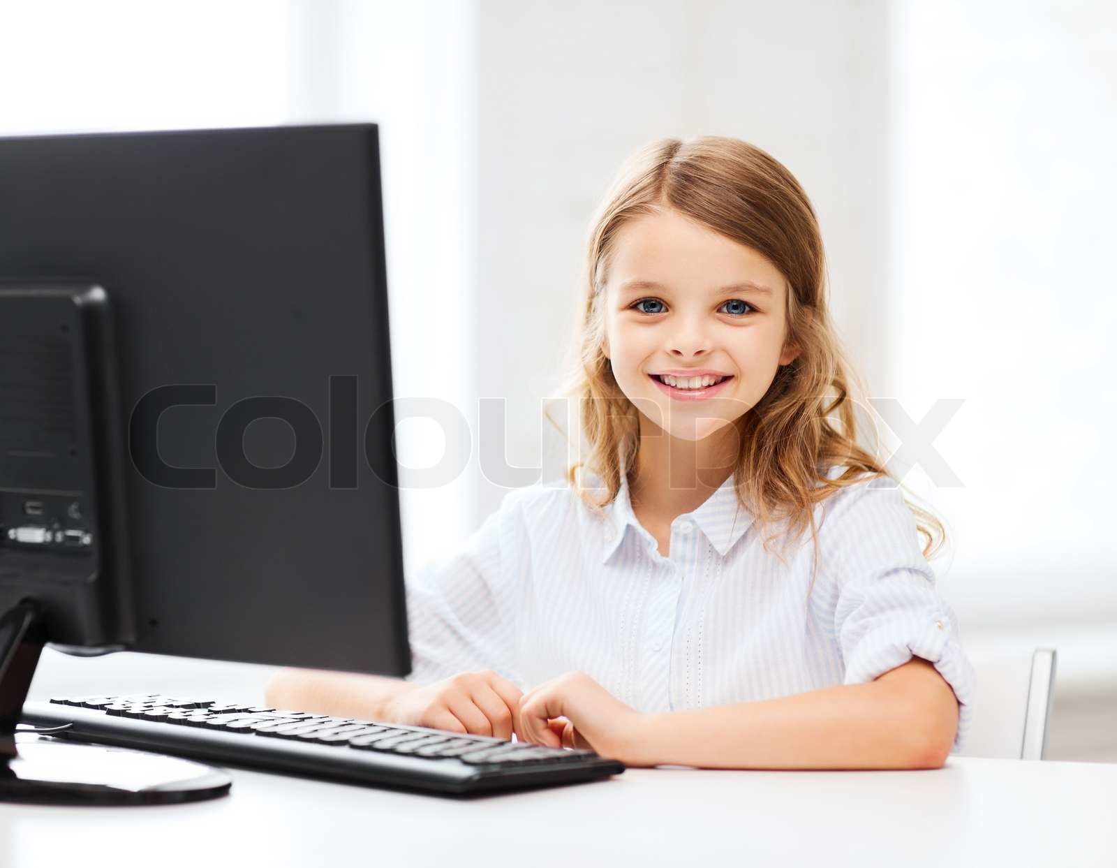 student girl with computer at school | Stock image | Colourbox