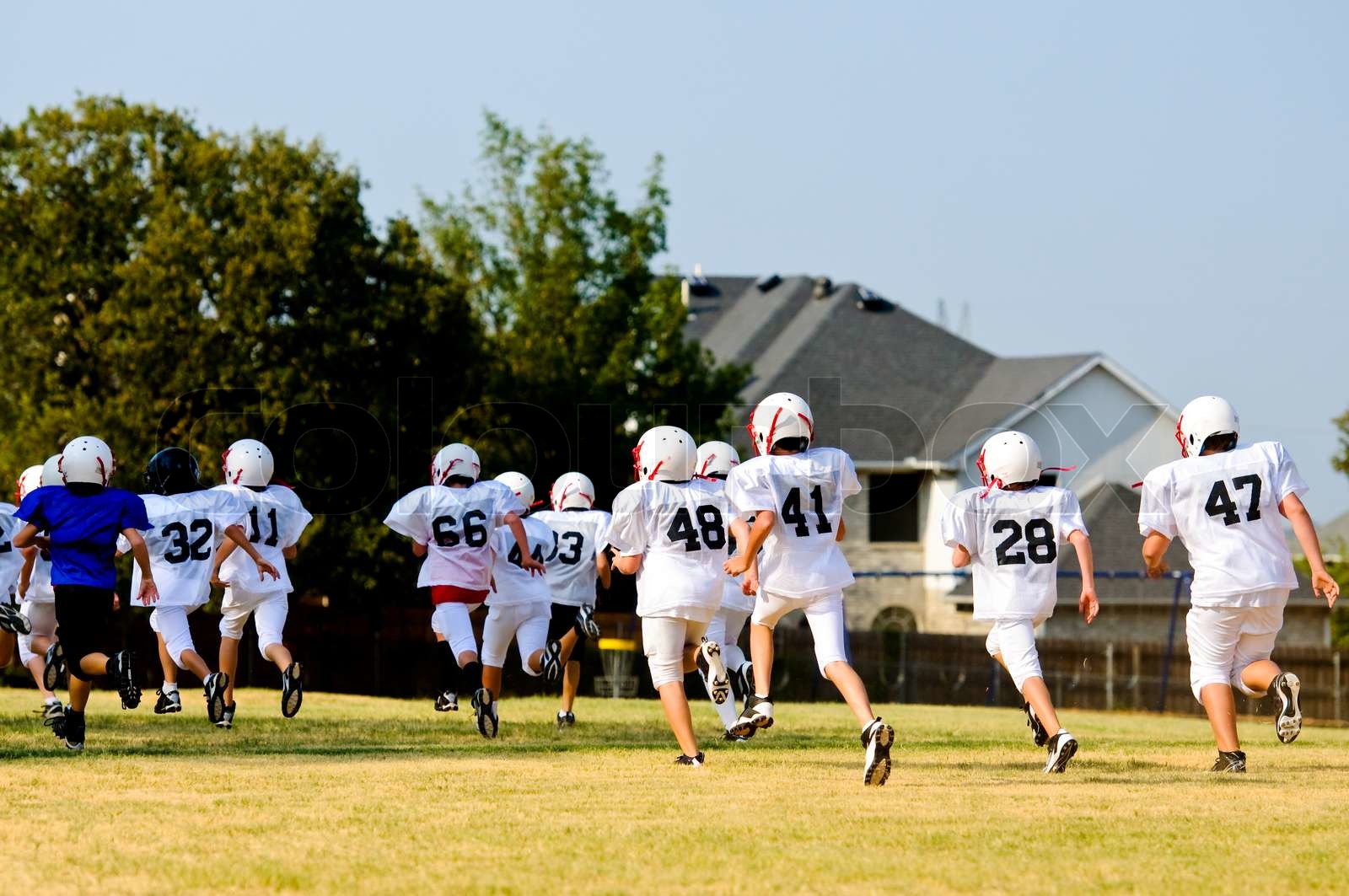 Football team running | Stock image | Colourbox