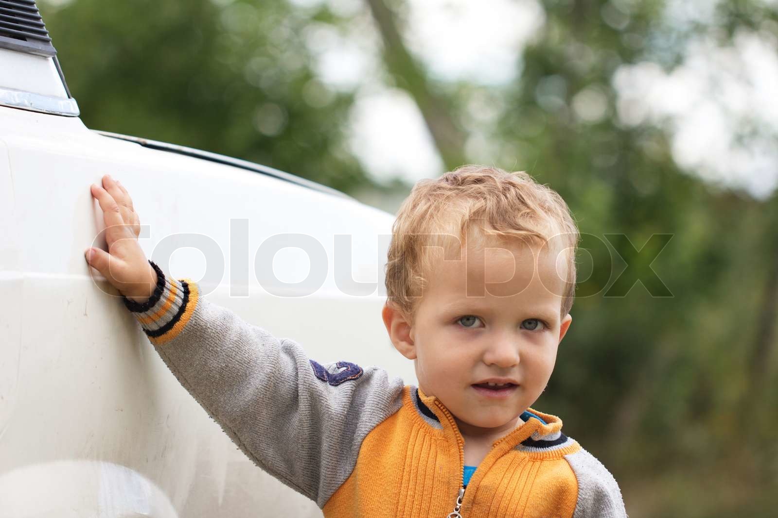 little boy near a car | Stock image | Colourbox