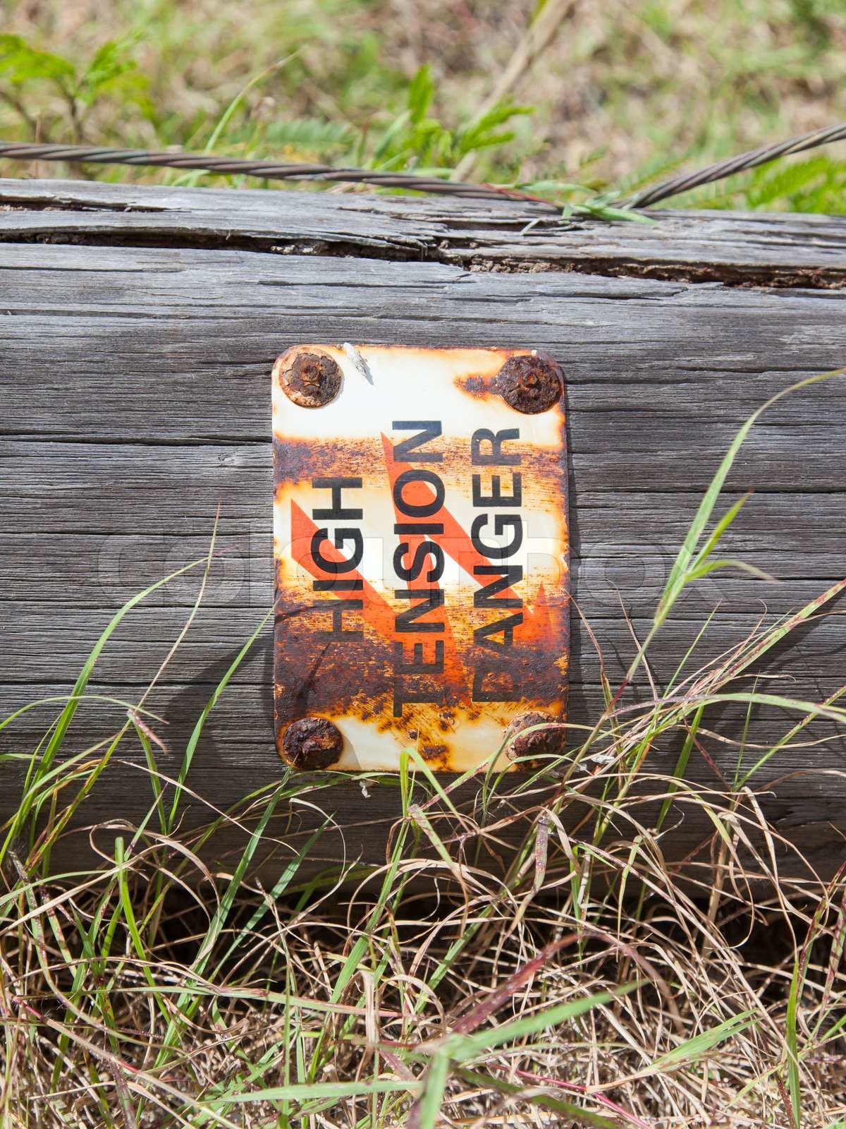 High tension danger sign on a pole | Stock image | Colourbox